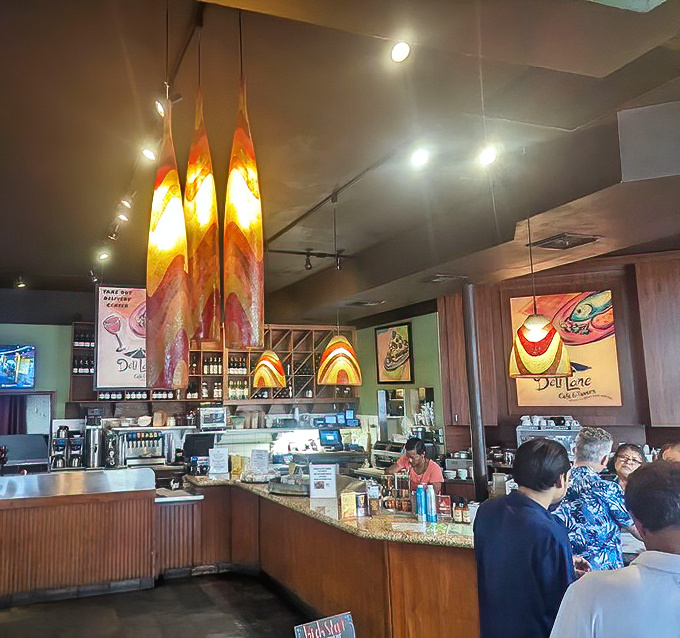 The counter area buzzes with morning energy&mdash;colorful pendant lights hanging like exclamation points above conversations and coffee refills.