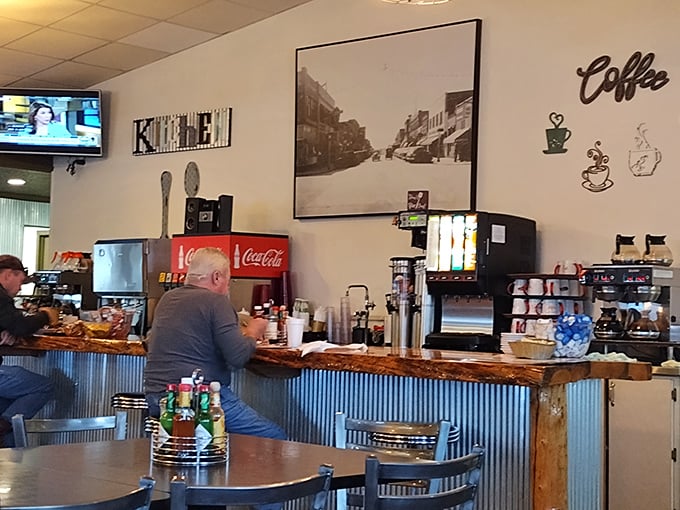 The coffee counter&mdash;where morning magic happens one cup at a time. That vintage Coca-Cola cooler has probably witnessed more breakfast epiphanies than a self-help guru.