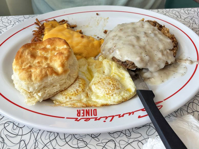 Country fried steak with gravy, eggs, and a biscuit that could float away if not weighed down by butter. Southern comfort on a plate.