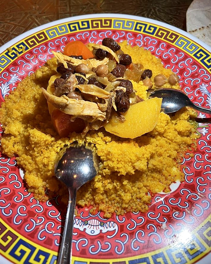 Fluffy couscous crowned with dried fruits and nuts creates the perfect foundation for soaking up every last drop of the fragrant sauce above.