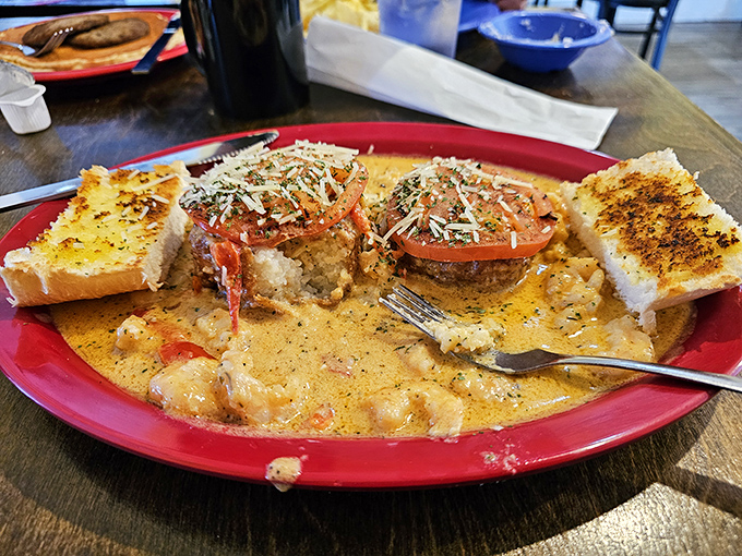 Creole shrimp and grits cakes swimming in a sauce so good you'll be plotting how to lick the plate without anyone noticing.