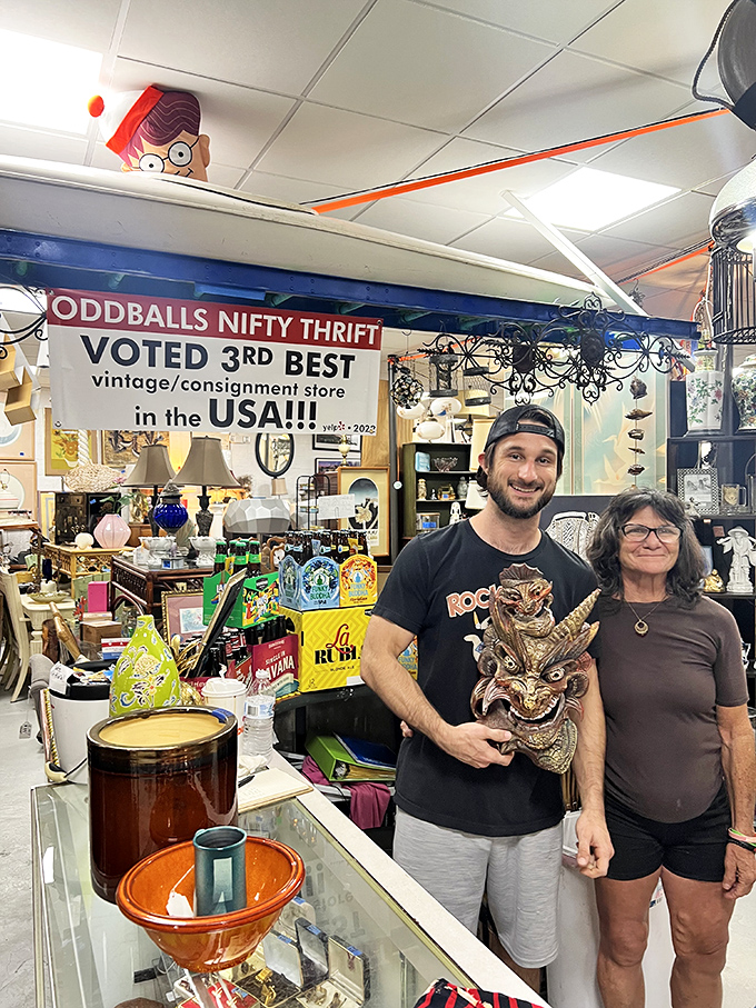 A sign proudly proclaiming national recognition hangs above treasure hunters who've struck gold. That wooden mask might be the find of the century.