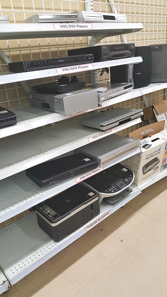 VHS and DVD players stand as technological time capsules, ready to unlock the movie collection you've refused to part with despite streaming everything.