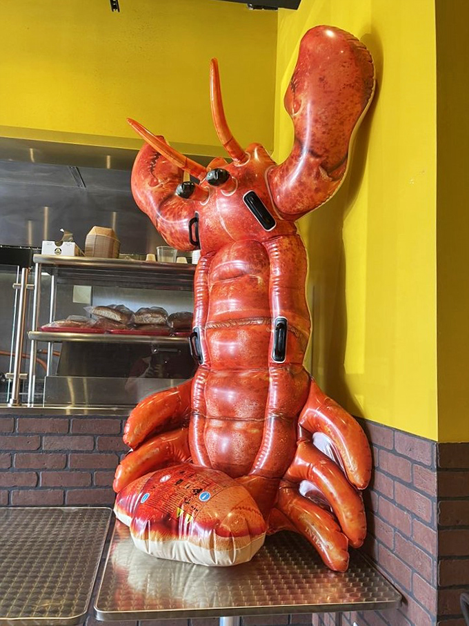 The giant lobster decoration isn't subtle, but neither is the restaurant's commitment to authentic seafood. This crimson sentinel guards the kitchen with pride.