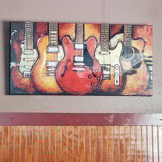 The guitar artwork on the wall isn't just decoration&mdash;it's foreshadowing the good times that happen when food, drinks, and music collide.