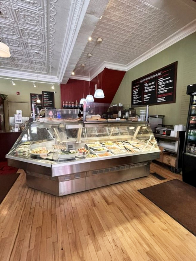 The deli counter gleams like a jewelry case, except these gems are marinated vegetables, pasta salads, and Italian specialties that make grocery store prepared foods weep with inadequacy.