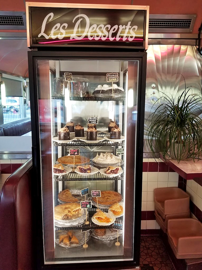 The dessert case&mdash;a glass-enclosed museum of temptation where willpower goes to die and diet plans are postponed until tomorrow.