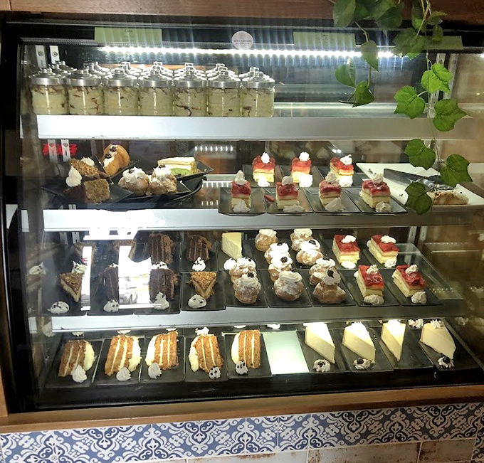 The dessert case – where willpower goes to die and "I'll just have a bite" becomes the lie you tell yourself.