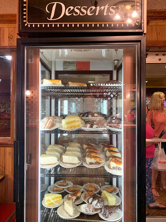 A dessert case that whispers sweet temptations, making you reconsider your "I'll just have a bite" promises
