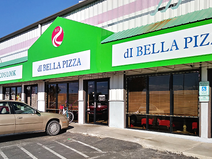 Di Bella Pizza's bright green awning signals Italian comfort food has found its desert home, promising cheese pulls that would make Instagram proud.