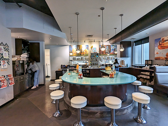 The curved counter offers front-row seats to the culinary show, where breakfast dreams are fulfilled one plate at a time.