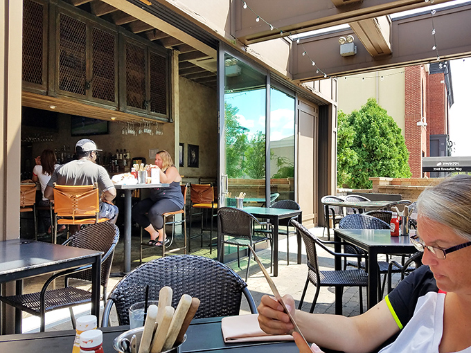 The patio seating offers a perfect perch for people-watching between bites. Al fresco dining that enhances the flavor.
