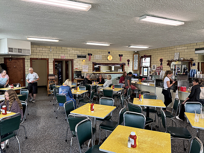 A dining room where strangers become neighbors, united by the universal language of "mmm" and "you've got to try this."