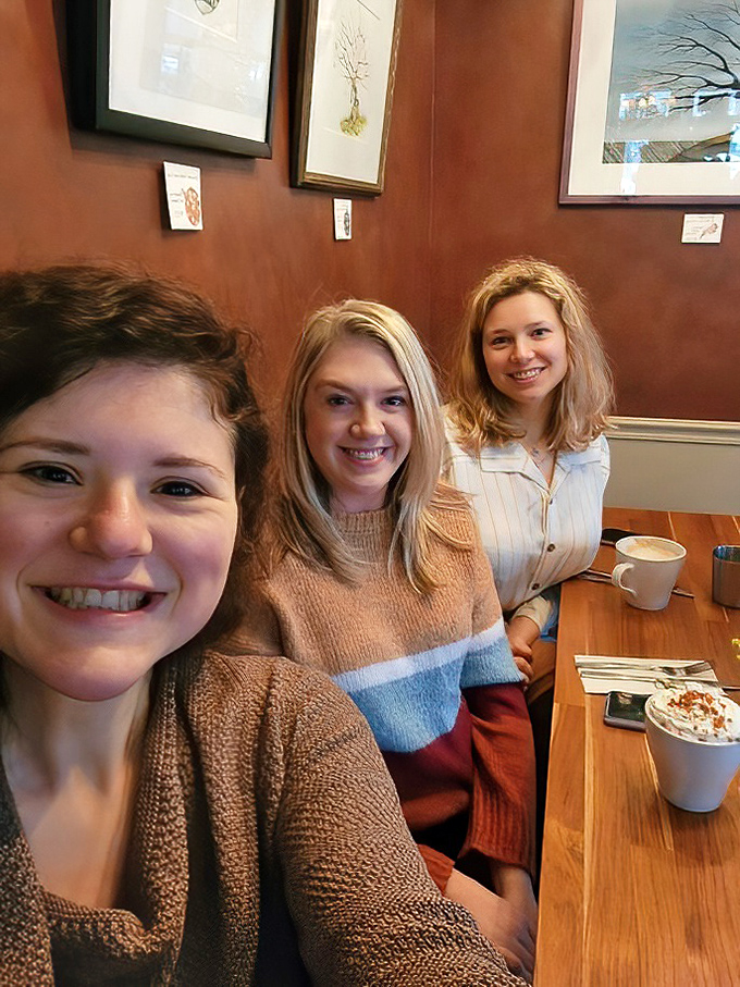 Happy diners sharing coffee and conversation&mdash;the universal language of "we found something good here." Some friendships are measured in coffee cups.