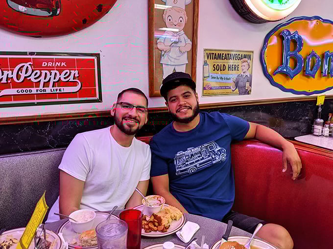 Two happy diners enjoying the fruits of Sherri's kitchen&mdash;their smiles say what words can't: "You should be eating this right now."