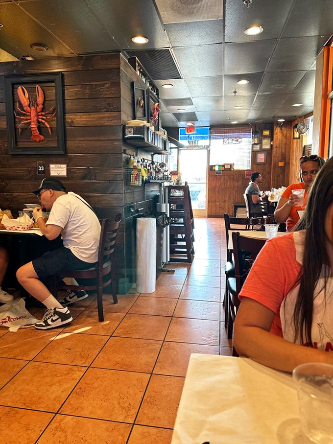 Diners focused on the serious business of seafood enjoyment, where conversation takes a backseat to the symphony of flavors.