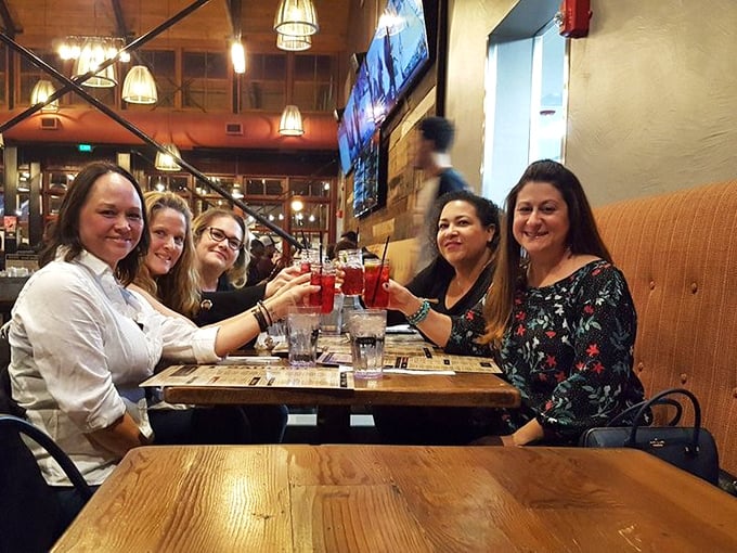 Friends toasting to good decisions, bad cholesterol, and the kind of meal that requires elastic waistbands.