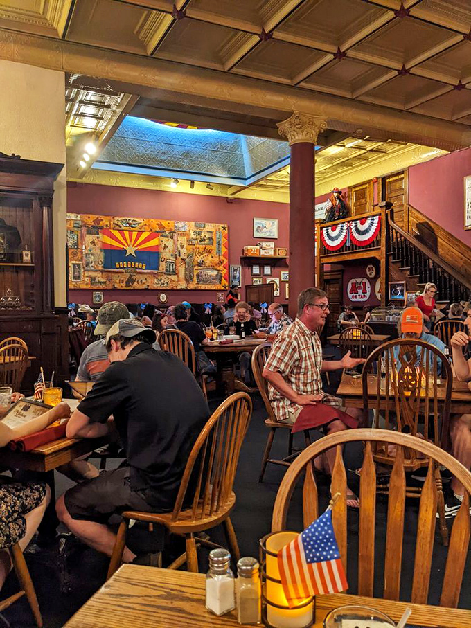 The dining room buzzes with energy as patrons enjoy meals beneath Arizona flags and Western decor&mdash;some traveling hours just for that famous prime rib.