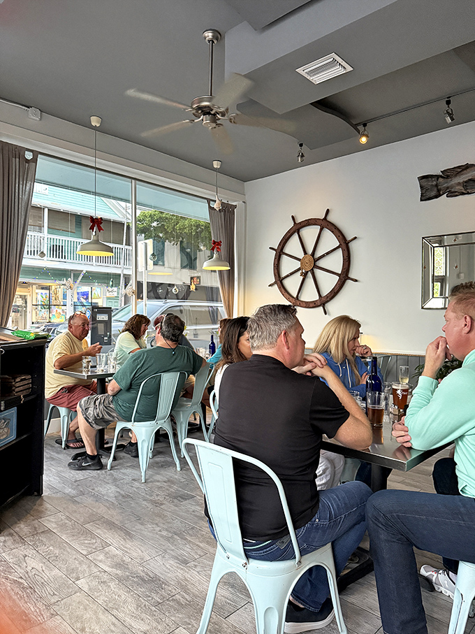 Happy diners lost in conversation and seafood bliss&mdash;the universal language of "this is so good I forgot what I was saying."