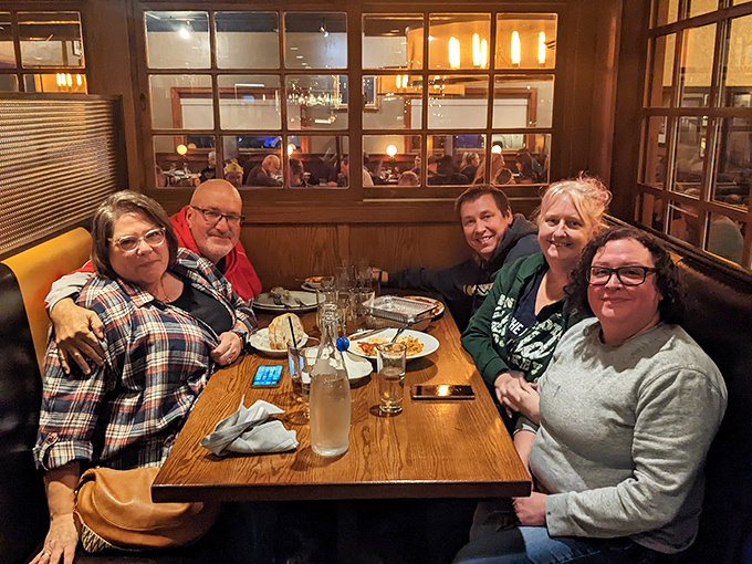 Happy diners gathered around the table, sharing laughs and pasta – this is what eating out should always feel like.