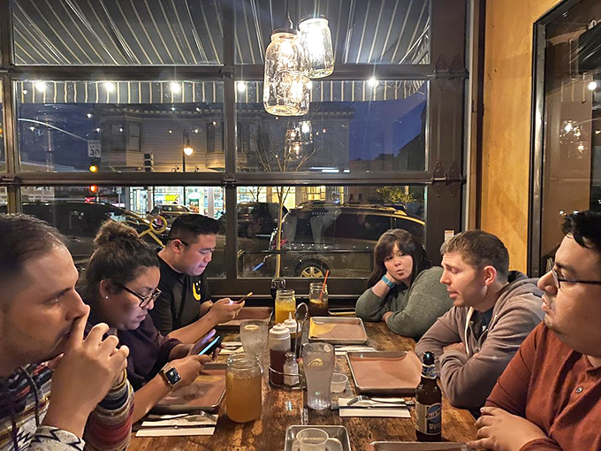 Nothing says "good times ahead" like a table of friends ignoring their phones because the BBQ demands their full, undivided attention.