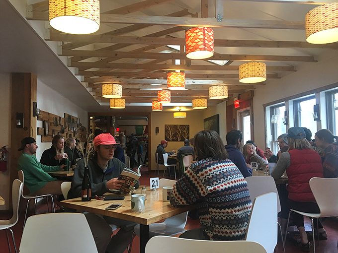 A dining room where strangers become friends, united by the universal language of "this food is amazing."