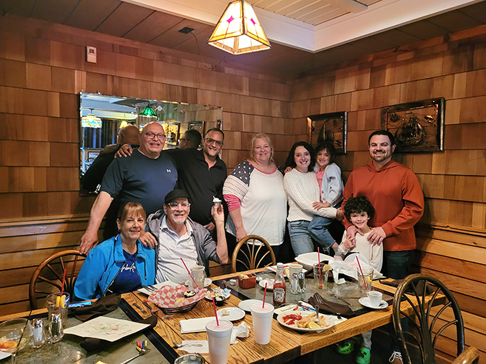 Happy diners gathered around a table laden with seafood treasures&mdash;the universal expression of "we ordered exactly right" on display.