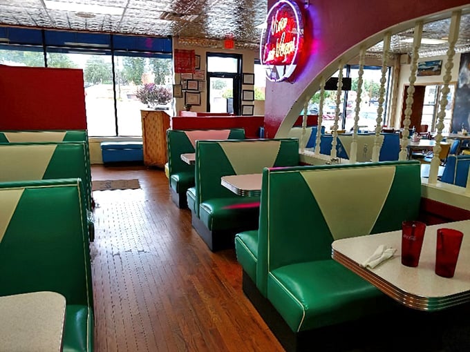 Classic diner booths in primary colors invite you to sit, stay awhile, and remember when dining felt communal.