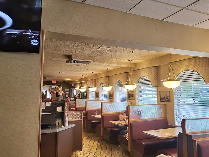 Pendant lights cast a warm glow over booths where countless birthdays, first dates, and family reunions have unfolded over plates of comfort food.
