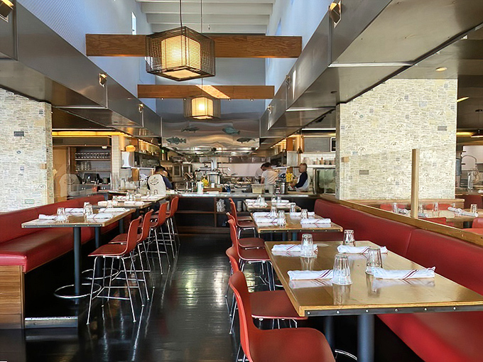 Red banquettes and wooden tables create that perfect sweet spot between "nice enough for a celebration" and "casual enough for Tuesday night."