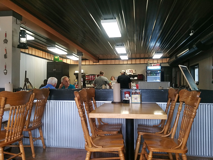 Wooden chairs and corrugated metal walls create the perfect backdrop for the real stars&mdash;those metal trays of smoky deliciousness heading your way.
