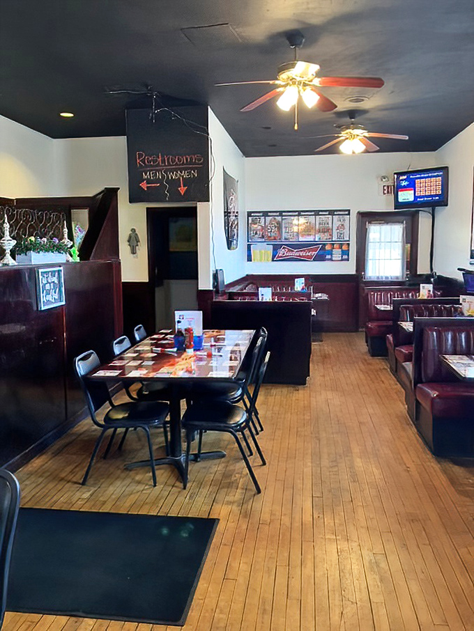The "Men/Women" directional sign adds that perfect touch of small-town charm to a dining room that balances casual comfort with "let's stay awhile" appeal.