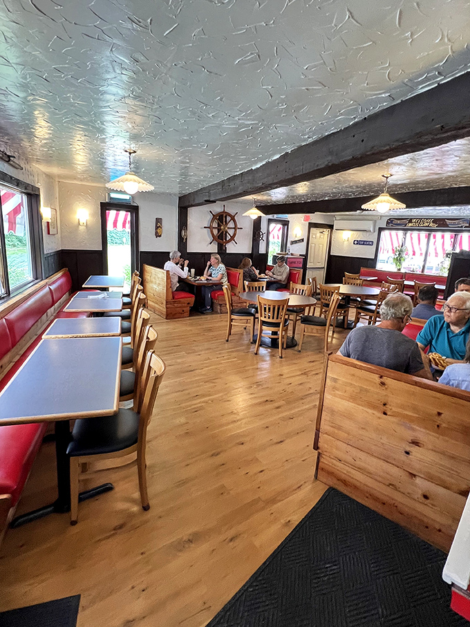 The dining room hums with the symphony of satisfied customers. Every wooden chair has supported decades of happy, full bellies.