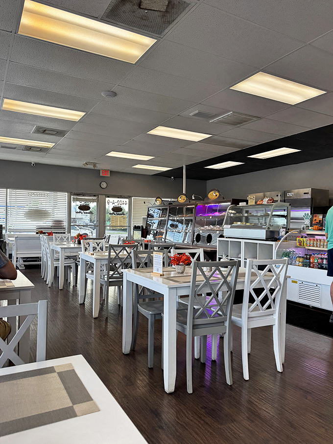 Clean, bright, and inviting&mdash;the dining area's white tables and cross-back chairs create the perfect canvas for the colorful food experience ahead.