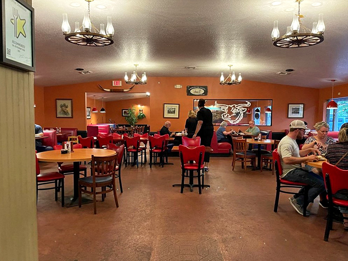 A dining room that invites you to settle in and stay awhile. Those red chairs have supported generations of happy, well-fed customers. 