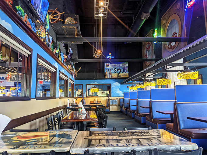 The dining room's blue and wood color scheme continues the nautical theme, with booths that resemble cozy ship's quarters.