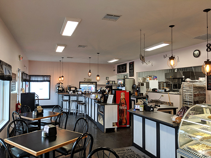 Simple tables and chairs become thrones when what's served here arrives. Edison bulbs overhead witness countless moments of pure culinary bliss daily.