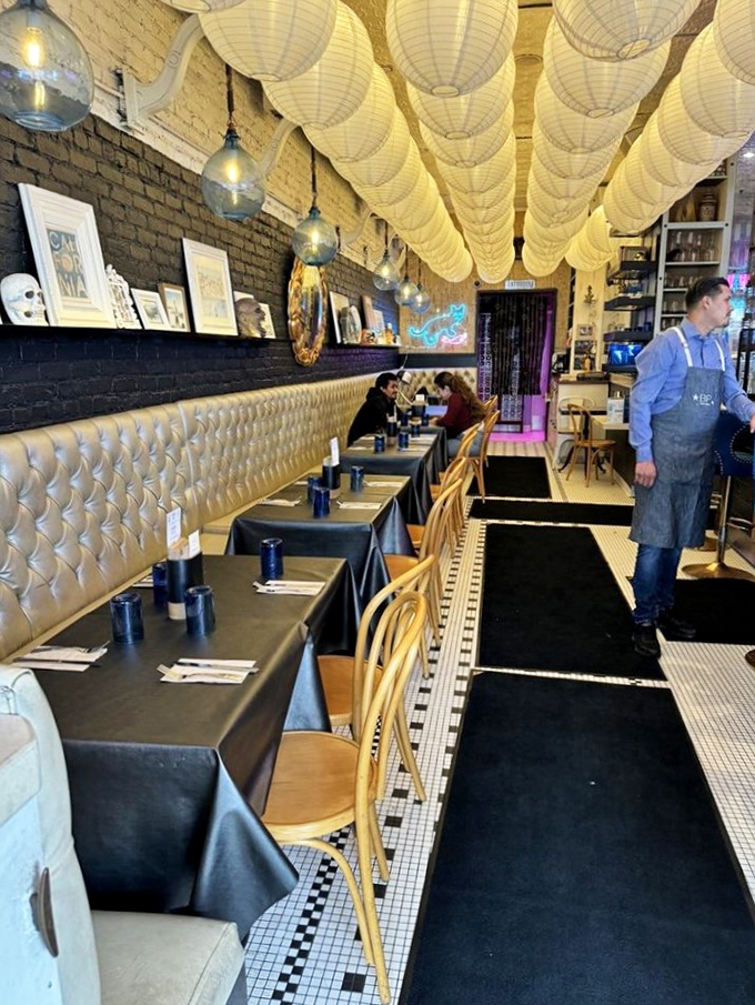 Fabric draped across the ceiling and tufted banquettes create an unexpectedly cozy atmosphere for your nautical feast.