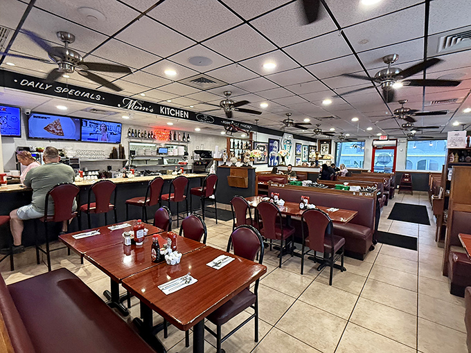 Spacious dining room with classic booth seating creates the perfect backdrop for leisurely meals.