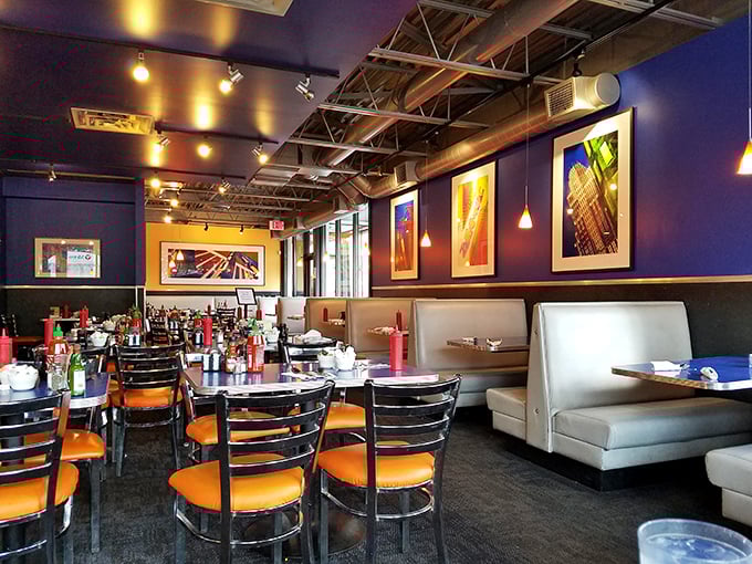 Modern diner aesthetics meet classic comfort in this dining area, where every booth has witnessed first dates, family reunions, and post-night-out recovery sessions.