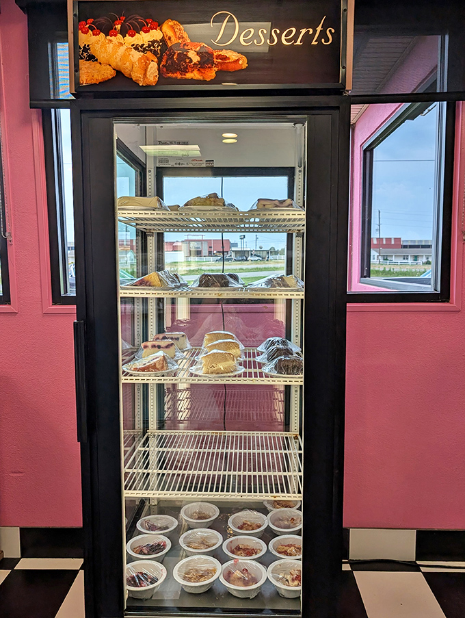 The dessert case stands like a trophy display of sweet achievements&mdash;each shelf promising a different path to happiness.
