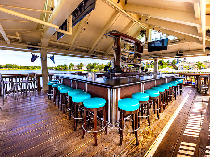 The dockside bar with its turquoise stools practically whispers, "Stay awhile, order another round, and watch the boats drift by."