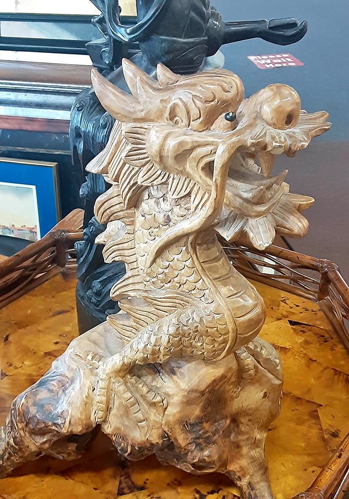 This intricately carved wooden dragon would make an excellent conversation starter &ndash; or guardian &ndash; for your home library.