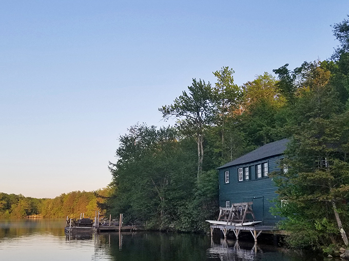 As evening approaches, this lakeside boathouse captures that magical golden hour when time seems to stand perfectly still.