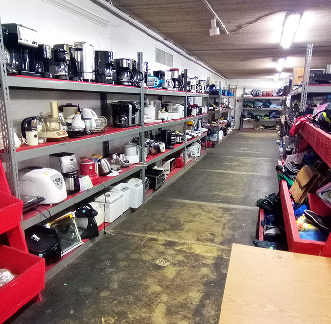The small appliance graveyard – where coffee makers and toasters wait patiently for their chance at kitchen counter redemption.