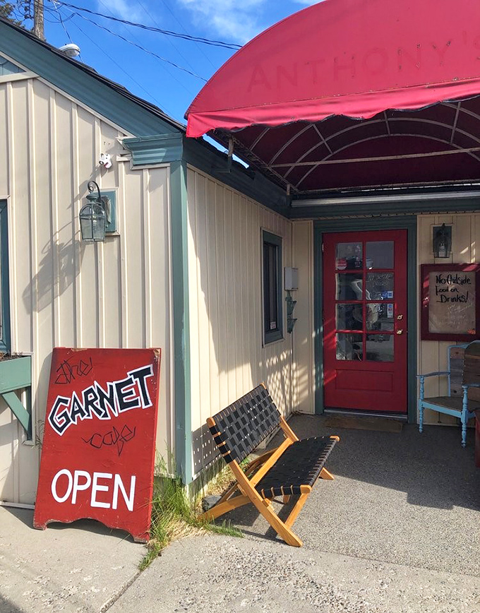 The red door and handwritten "OPEN" sign might as well say "Happiness served daily"&mdash;a promise The Garnet Cafe delivers on with every plate.