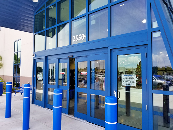 The bright blue entrance beckons shoppers with the promise of air conditioning and unexpected treasures just beyond those automatic doors.
