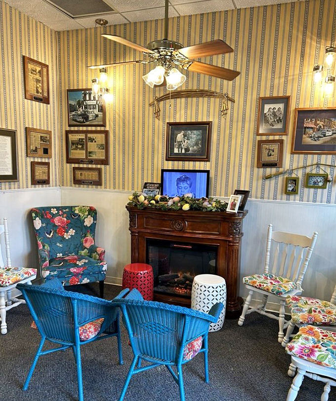 The cozy fireplace corner invites you to linger a little longer, surrounded by framed memories of simpler times.