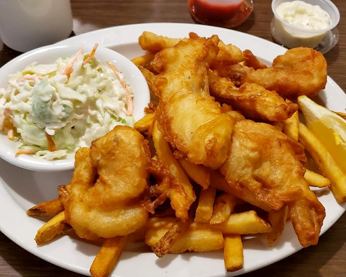 Fish and chips that would make a British pub nervous. The golden batter shatters with each bite, revealing perfectly flaky fish beneath.