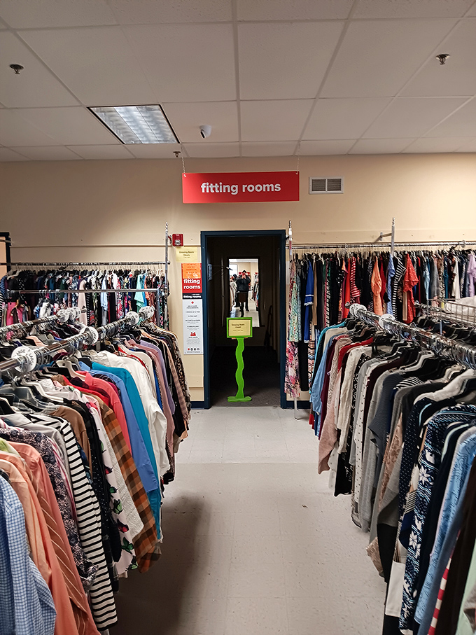 The fitting room corridor &ndash; where fashion dreams either soar or crash spectacularly. The truth awaits behind that humble doorway. 